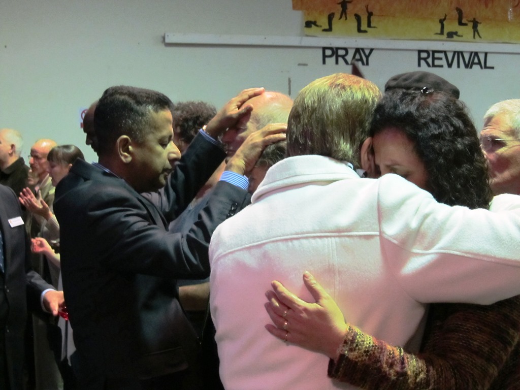 Ministering at the altar at Reformation Harvest Fire Ministries